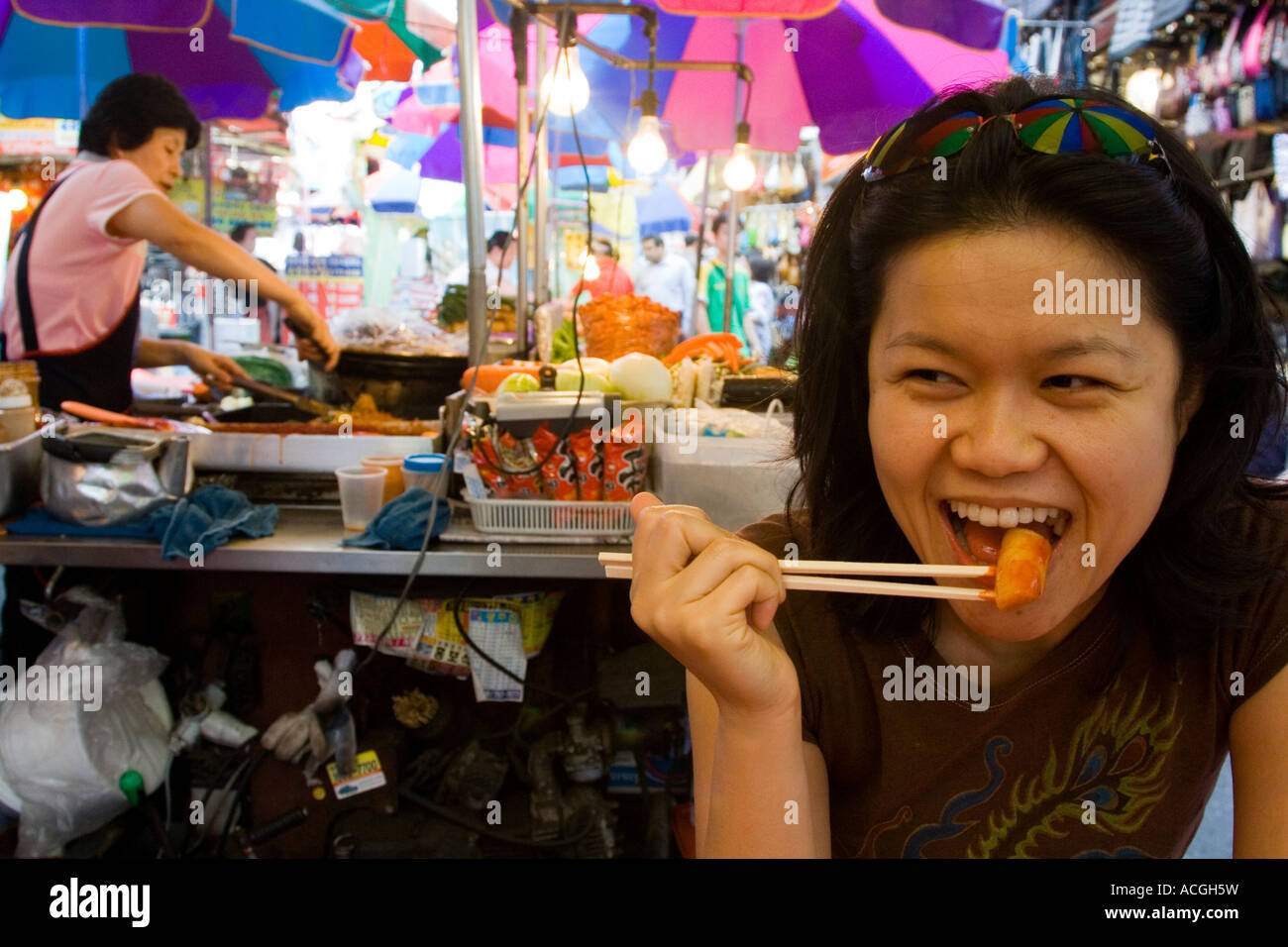Korea street food eating rice cake hi-res stock photography and images ...