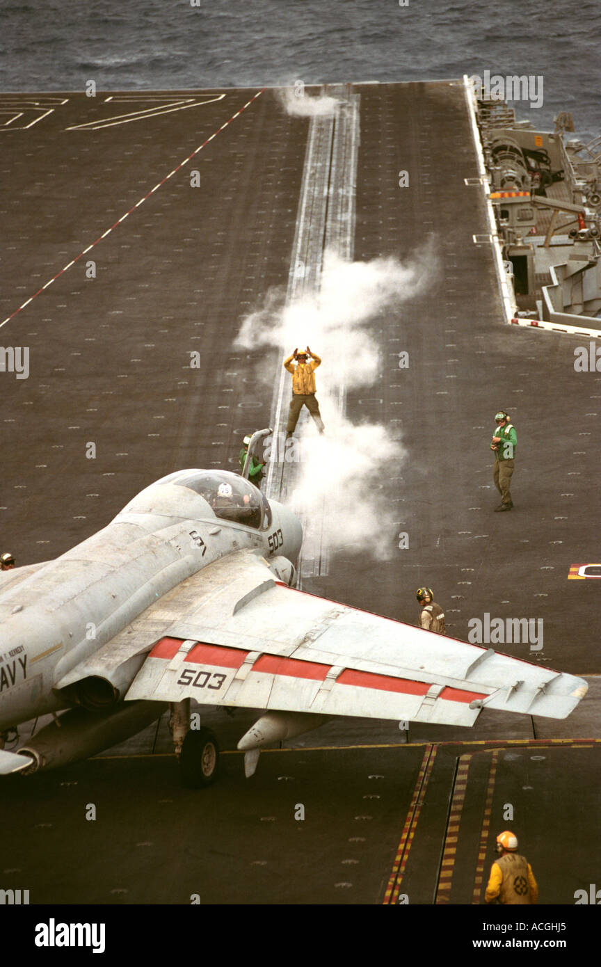 Waist catapult officers (the "shooters") launch an F14 Tomcat from the ...