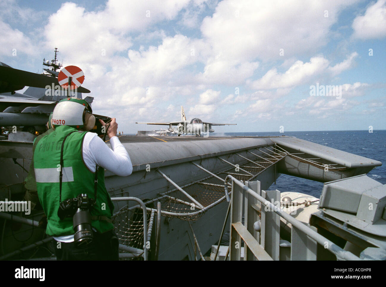 Ships Photographer in action by waist catapult on USS JOHN F. KENNEDY ...