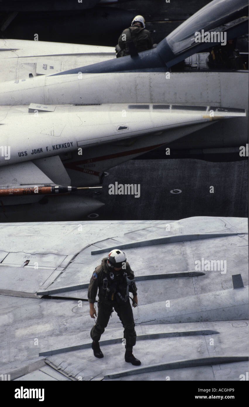 F-14 Tomcat Pilots wait for order and perform pre flight inspections ...