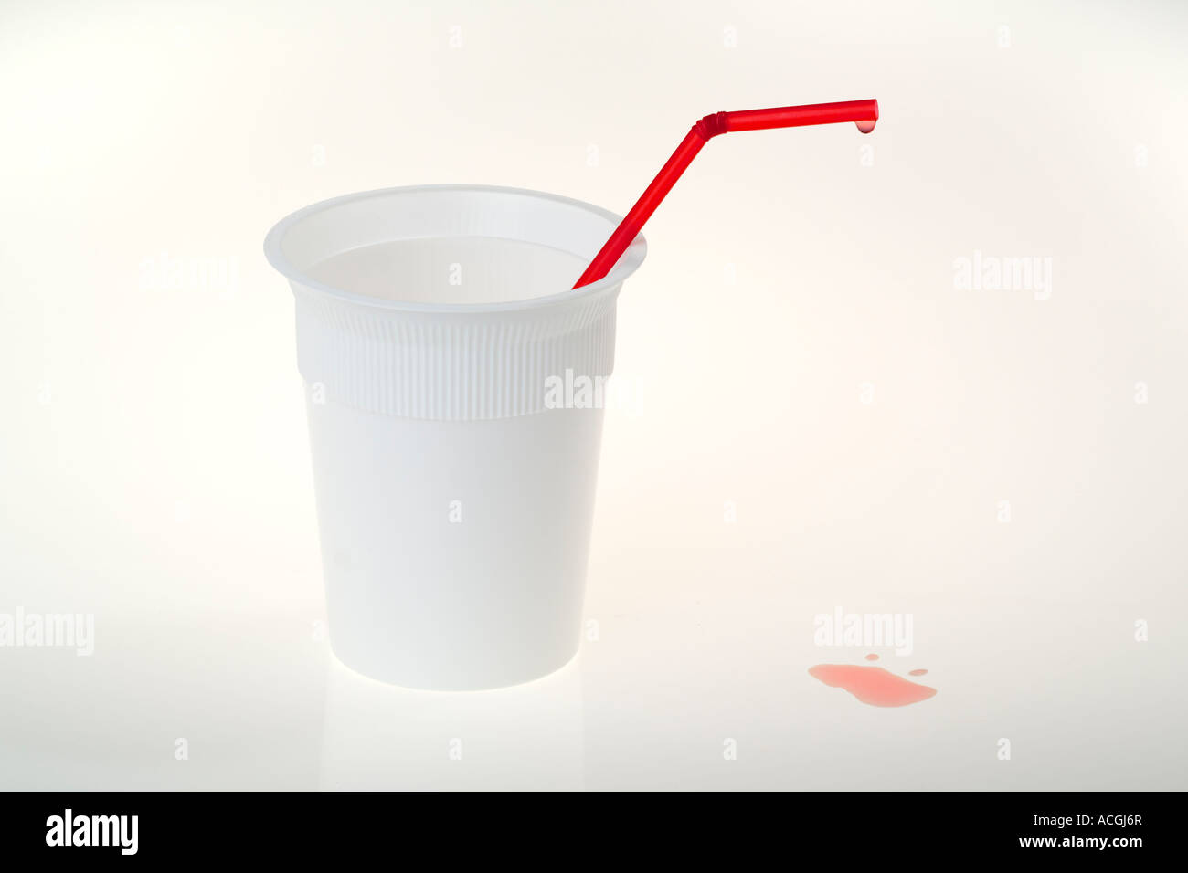 White drinking plastic cup with red straw Stock Photo - Alamy