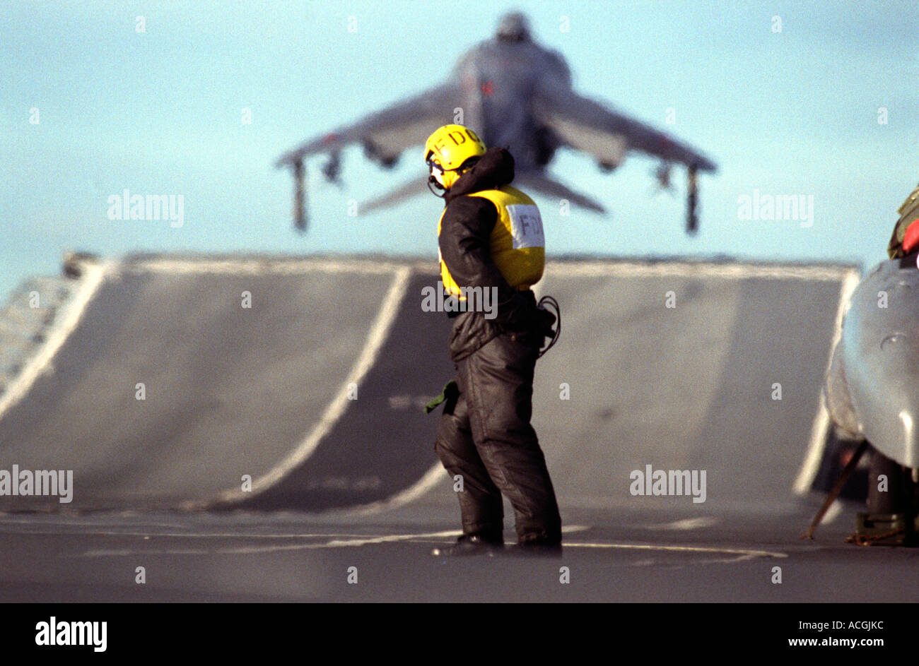 Royal Navy Flight deck Captian launches Sea Harrier from Flight deck of ...