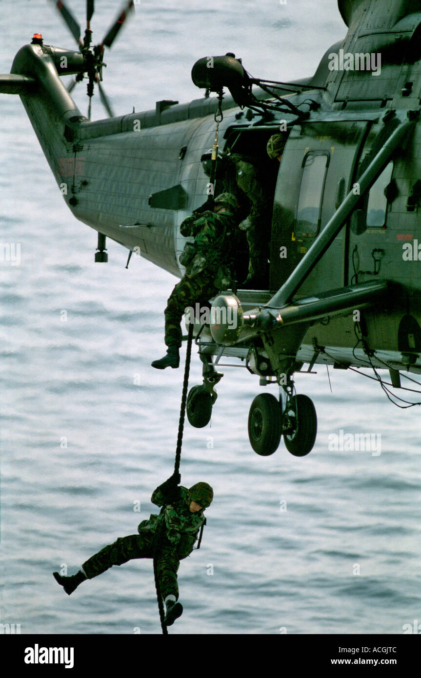 Royal Navy boarding party rapid ropeing out of Royal Marine seaking ...