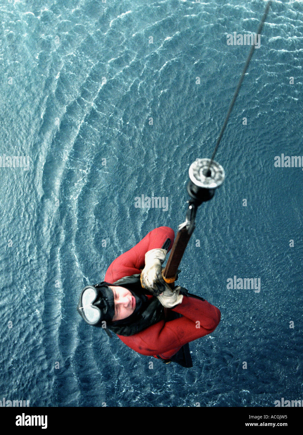 Search and Rescue Diver being winched into seaking helecopter Stock ...