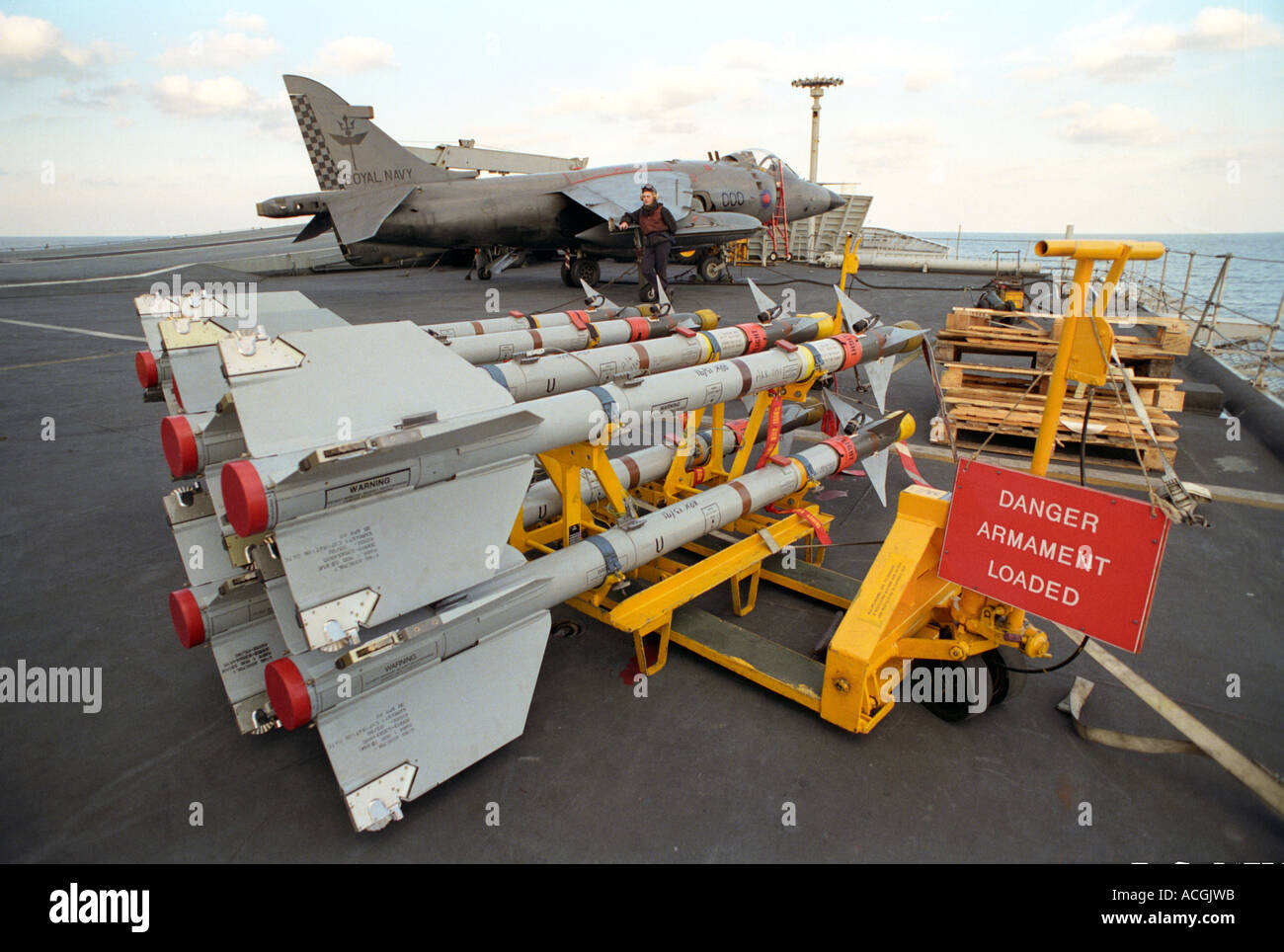 Sidewinder missiles on HMS Illustrious Harrier in background Stock ...