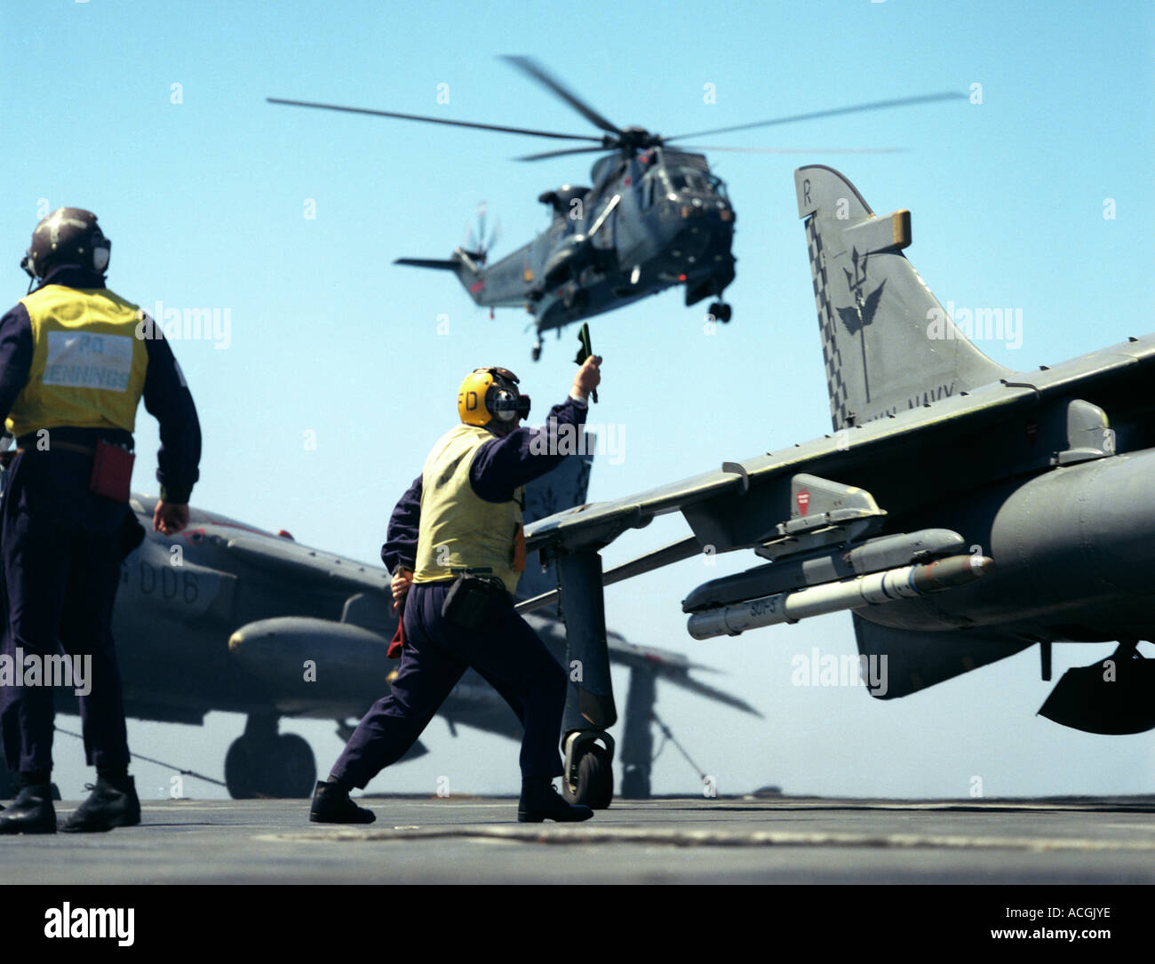 Flight deck Officer launches Sea Harrier from the flight deck of HMS ...