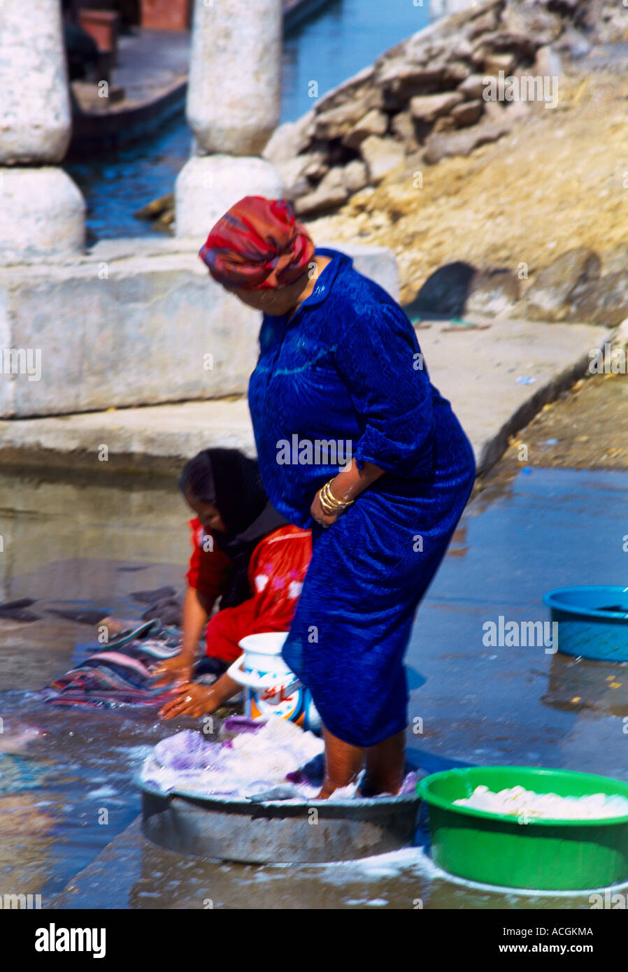 Nile Luxor Egypt West Bank Women Washing Clothes with Feet Stock Photo ...