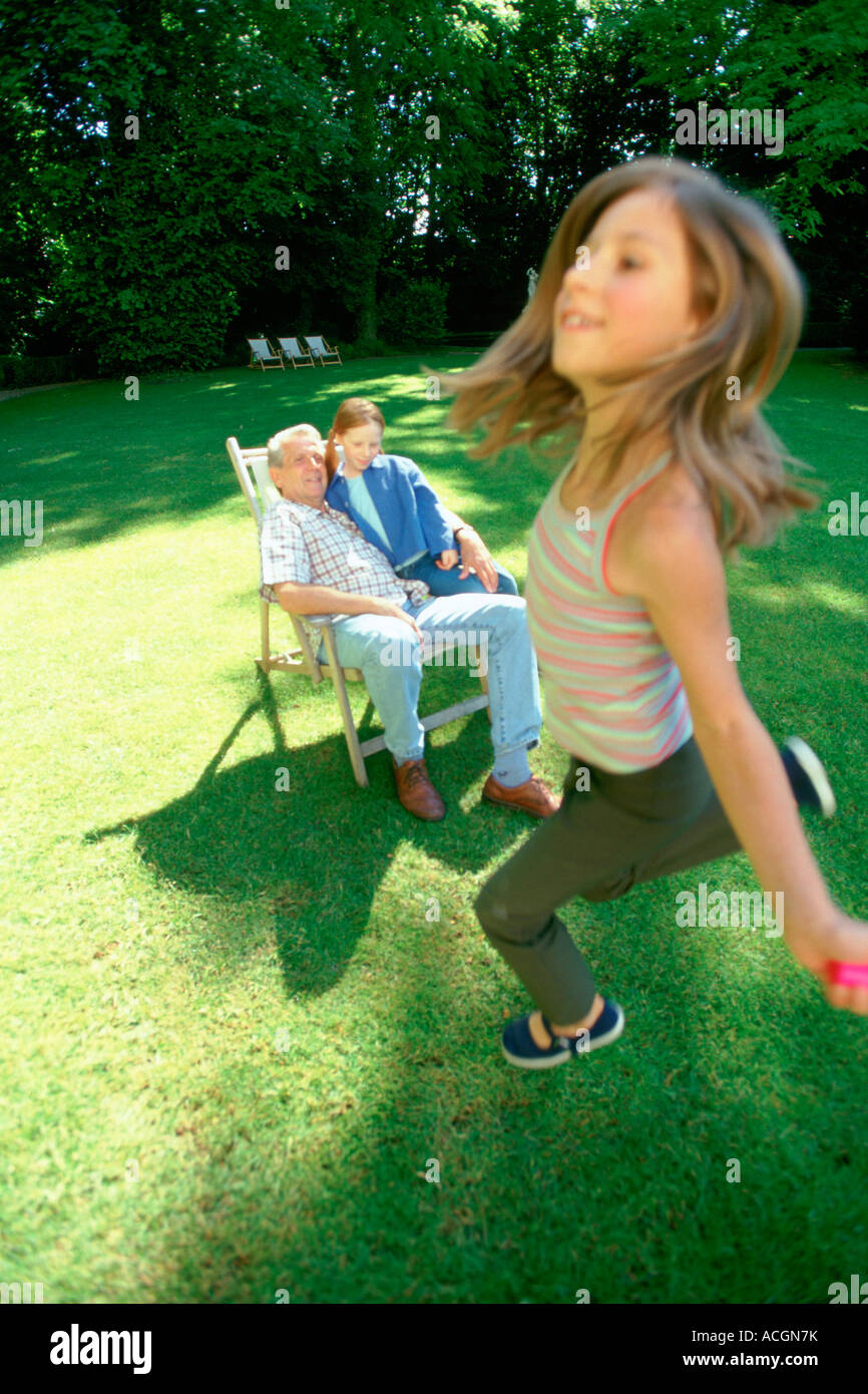 Little girl playing in a park Stock Photo - Alamy
