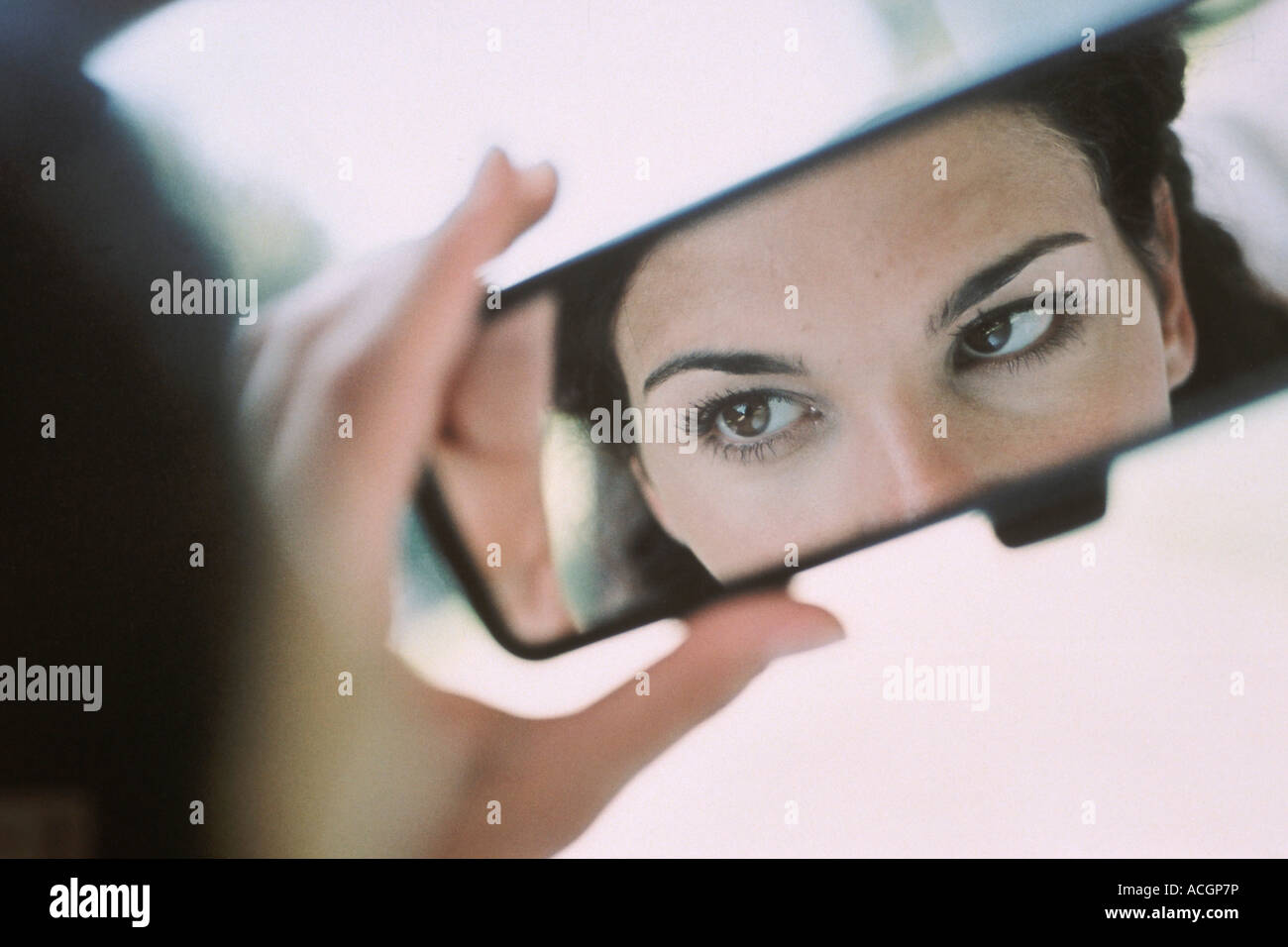Woman s face in rear view mirror Stock Photo - Alamy