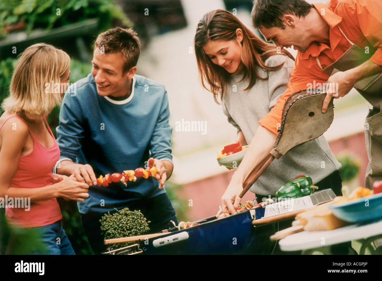 People preparing barbecue Stock Photo - Alamy