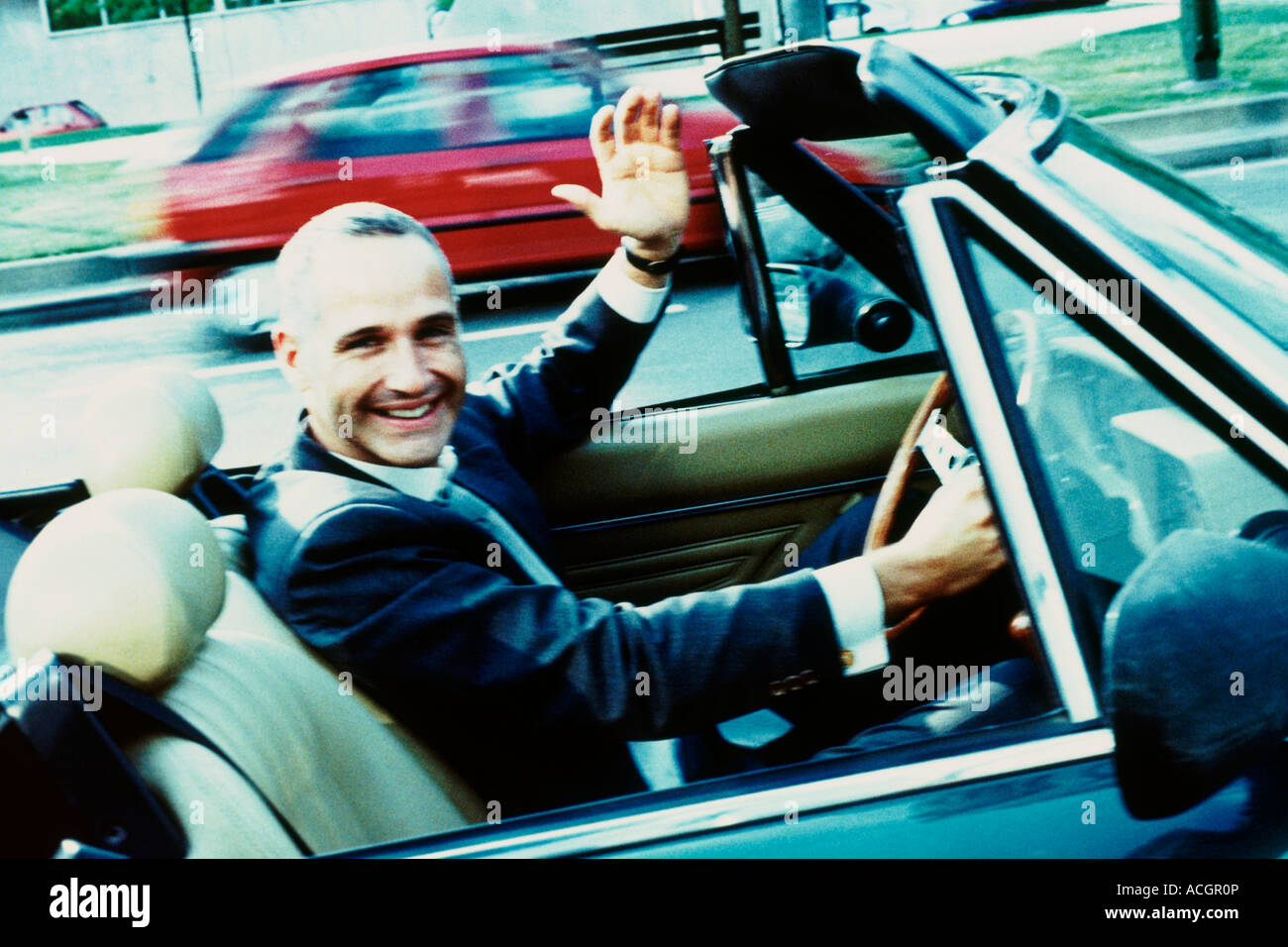Smiling man in car hand gesture special effects Stock Photo - Alamy