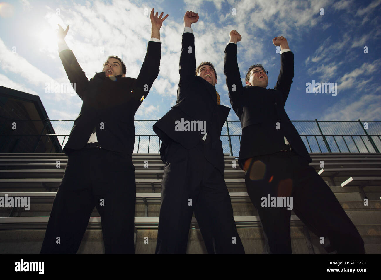 Group of jubilant businessmen Stock Photo - Alamy