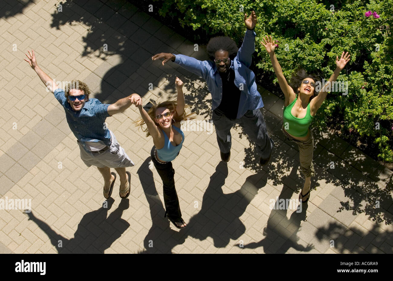 Group of friends jumping for joy Stock Photo - Alamy