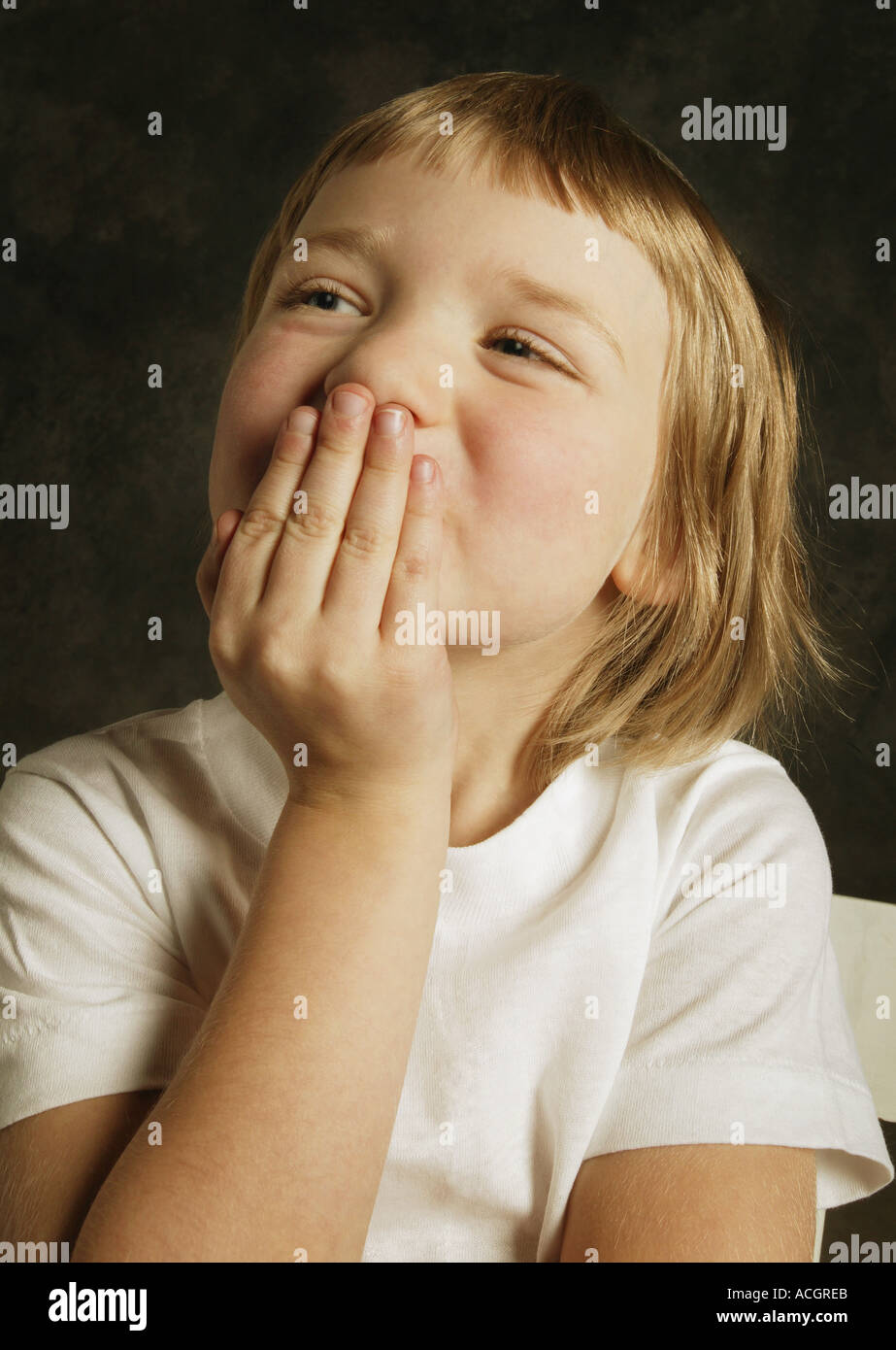 Child hand over mouth laugh hi-res stock photography and images - Alamy