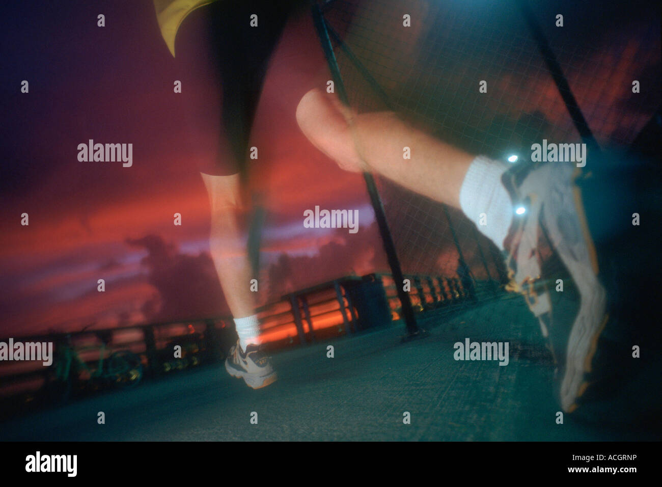 Man running in the middle of the night Stock Photo - Alamy