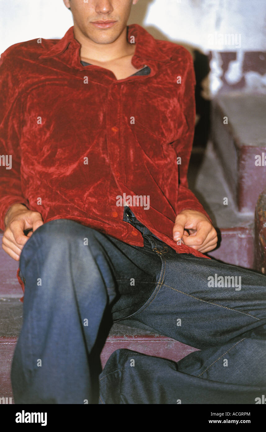 Young man sitted on couch Stock Photo - Alamy