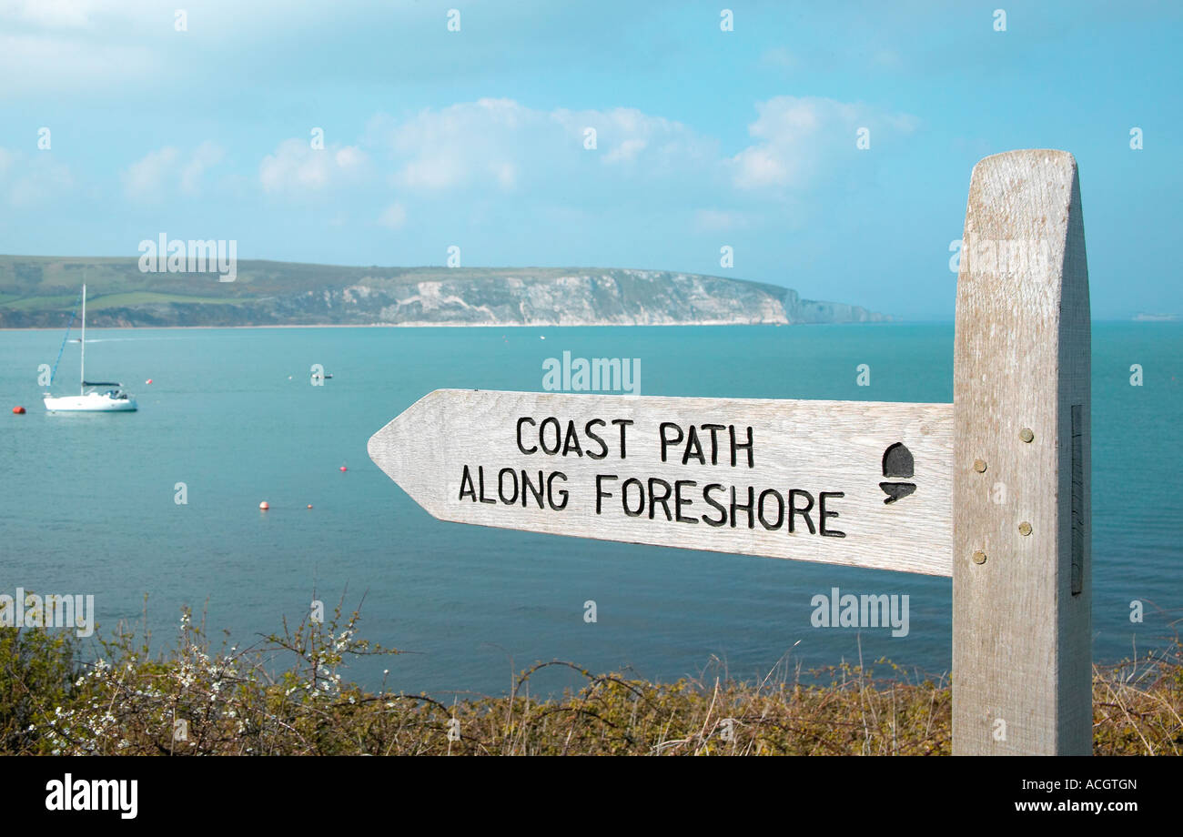 A coastal path walkway sign overlooking a beautiful english seaside bay ...