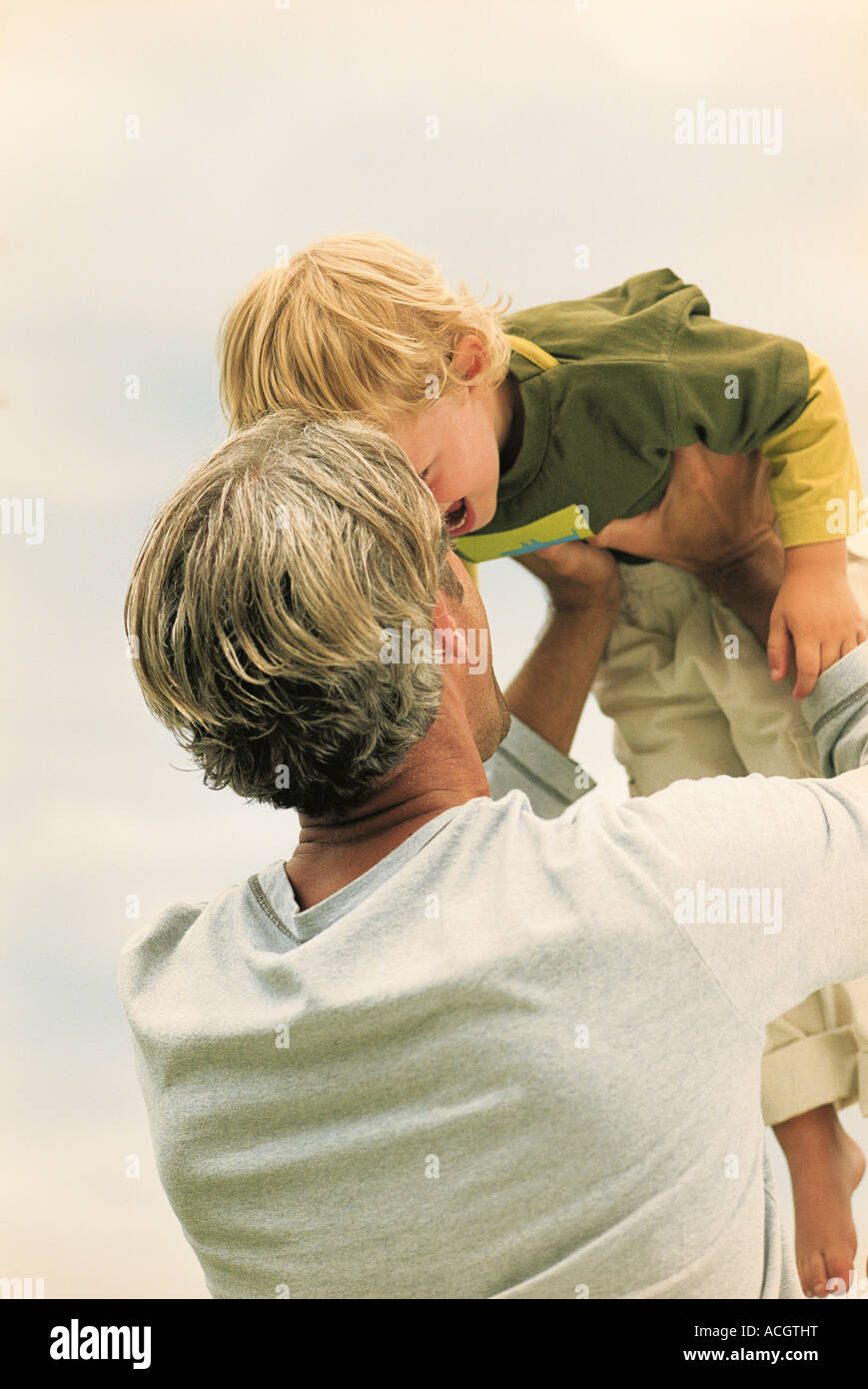 Man carrying little boy Stock Photo - Alamy