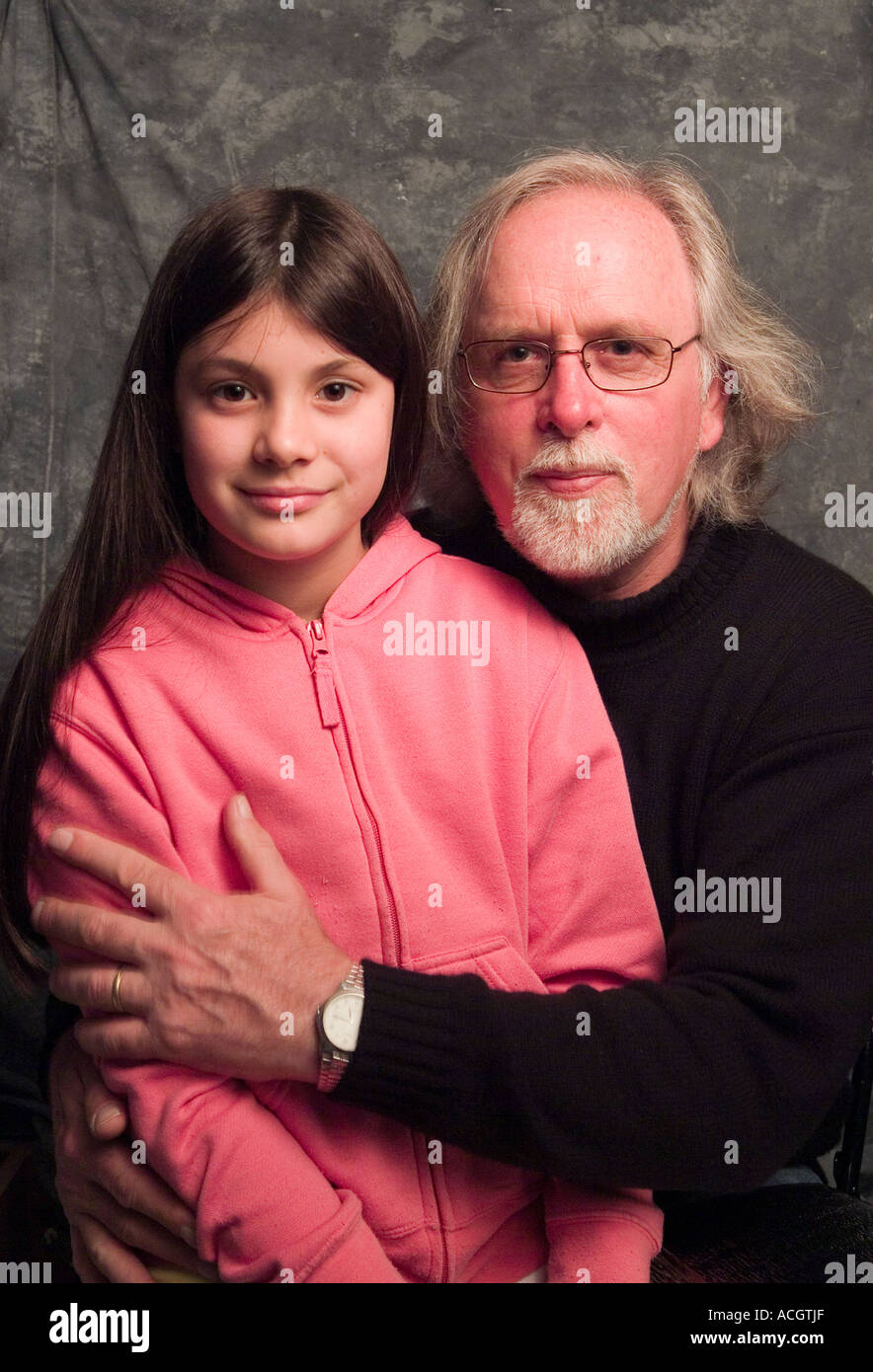 An older male parent with young pretty daughter Stock Photo - Alamy