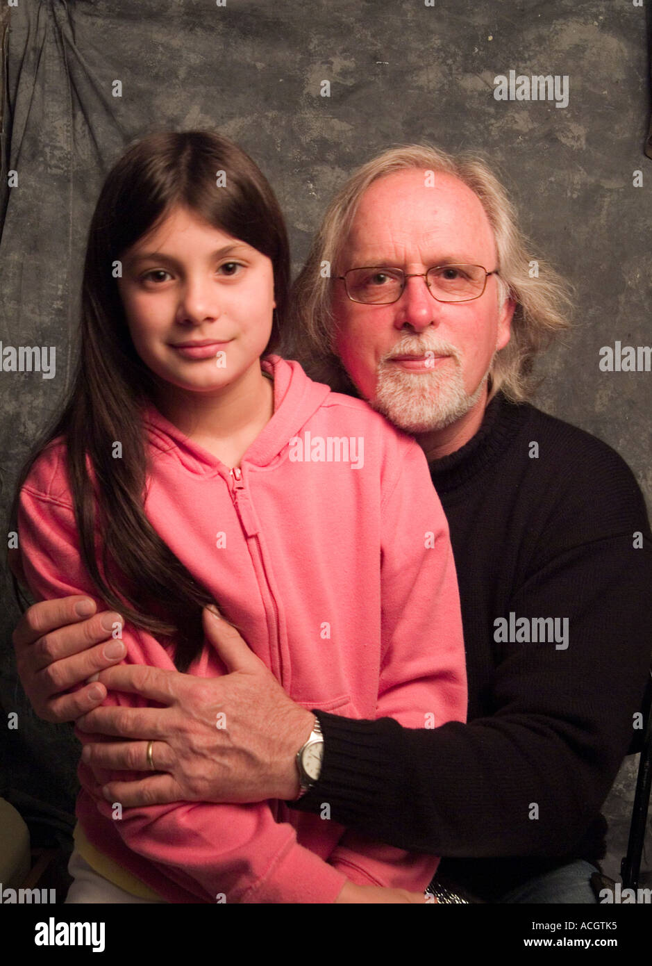 An older male parent with young pretty daughter Stock Photo - Alamy