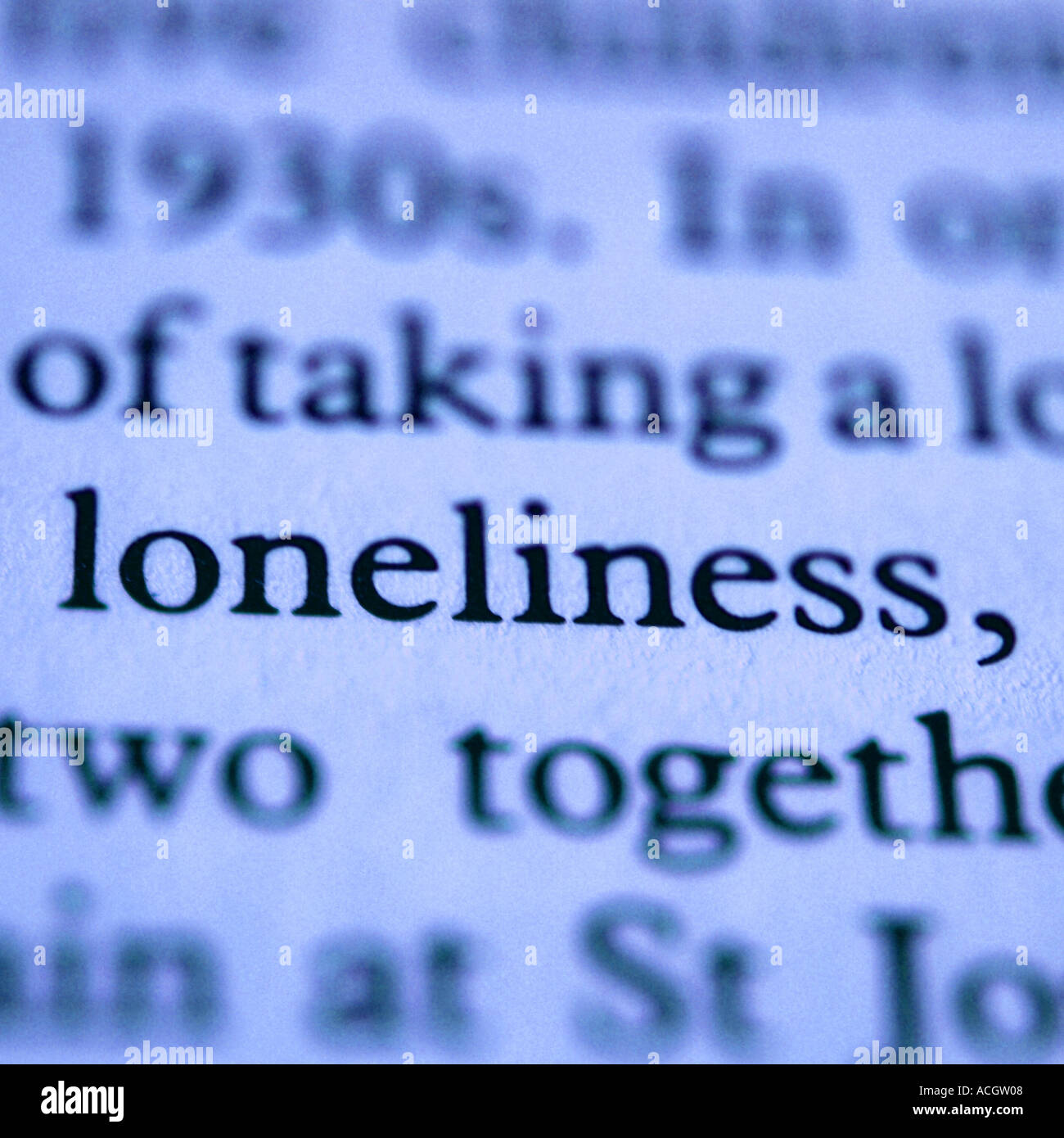 Close up text featuring the words loneliness Stock Photo - Alamy