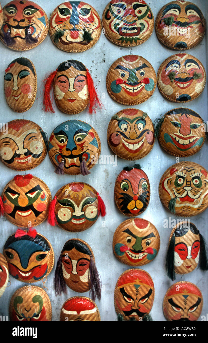 Selection of colourful hand painted Vietnamese masks for sale on a ...