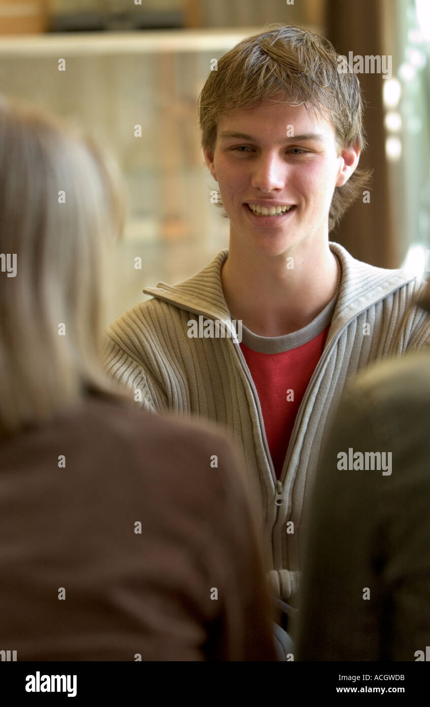 Teenage boy talking to girls Stock Photo - Alamy