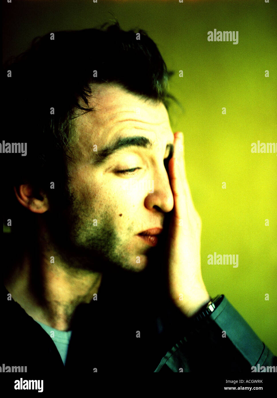 Portrait tired looking young man Stock Photo - Alamy