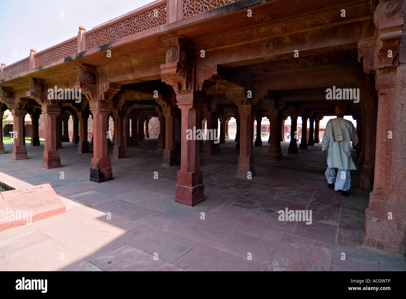 A MAN IS WALKING TOWARDS THE FIRST STORY BUILDING OF PUNCH MAHAL THE ...