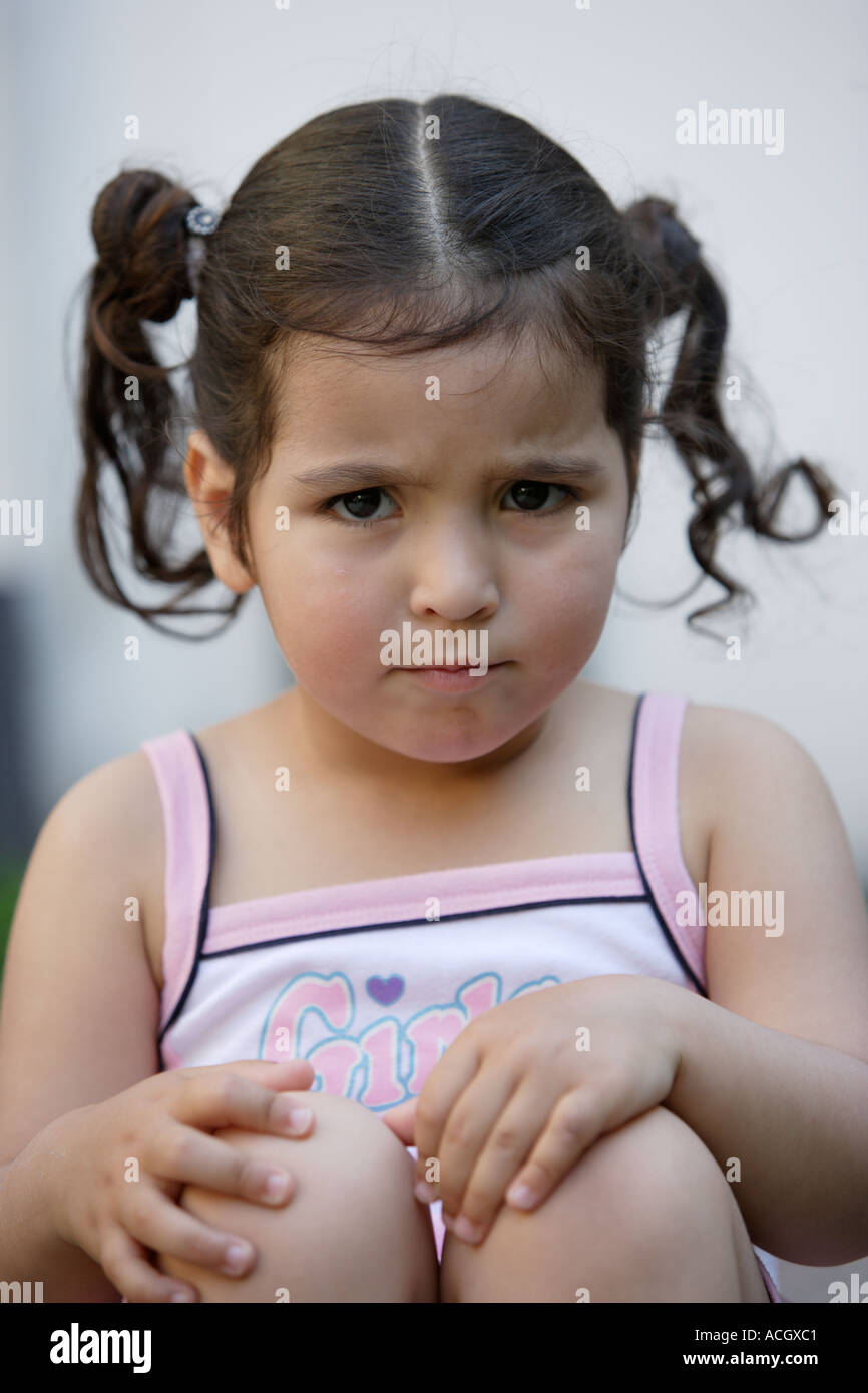 Portrait of an angry little girl Stock Photo - Alamy