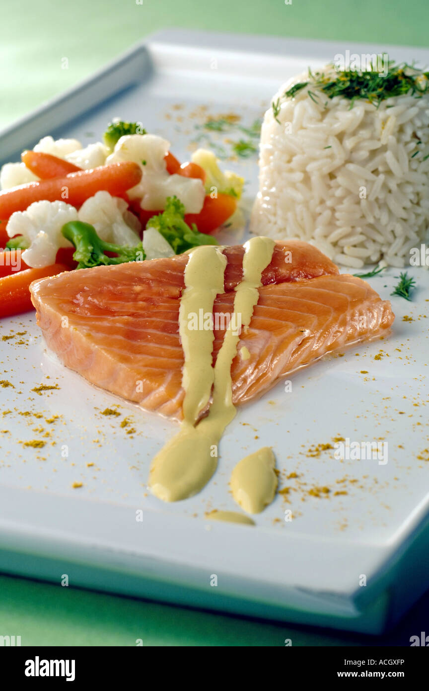 Fillet of salmon with rice and steamed vegetables Stock Photo - Alamy