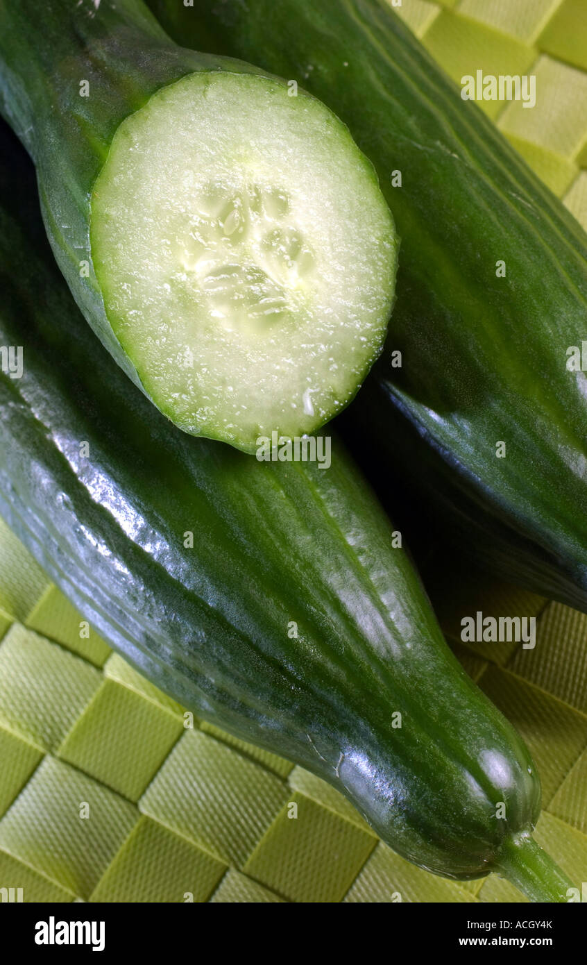 Whole and cut cucumbers Stock Photo - Alamy