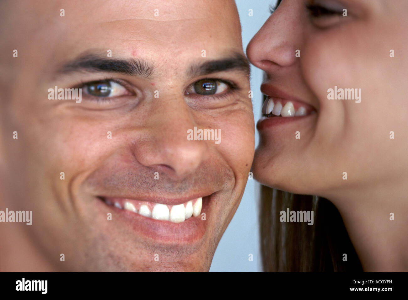 Close up on bald man and smiling woman s faces Stock Photo - Alamy