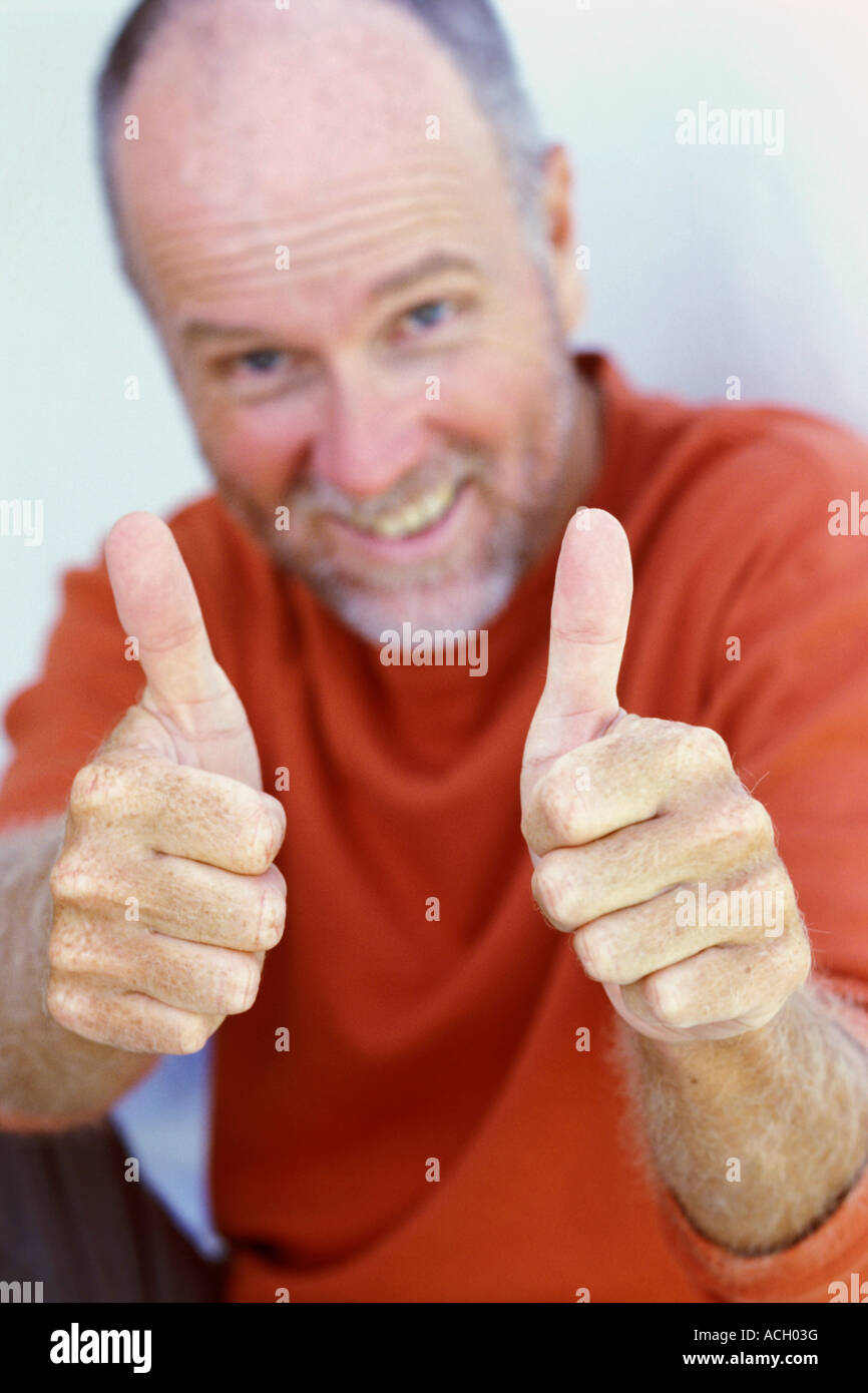 Portrait smiling man thumbs up Stock Photo - Alamy