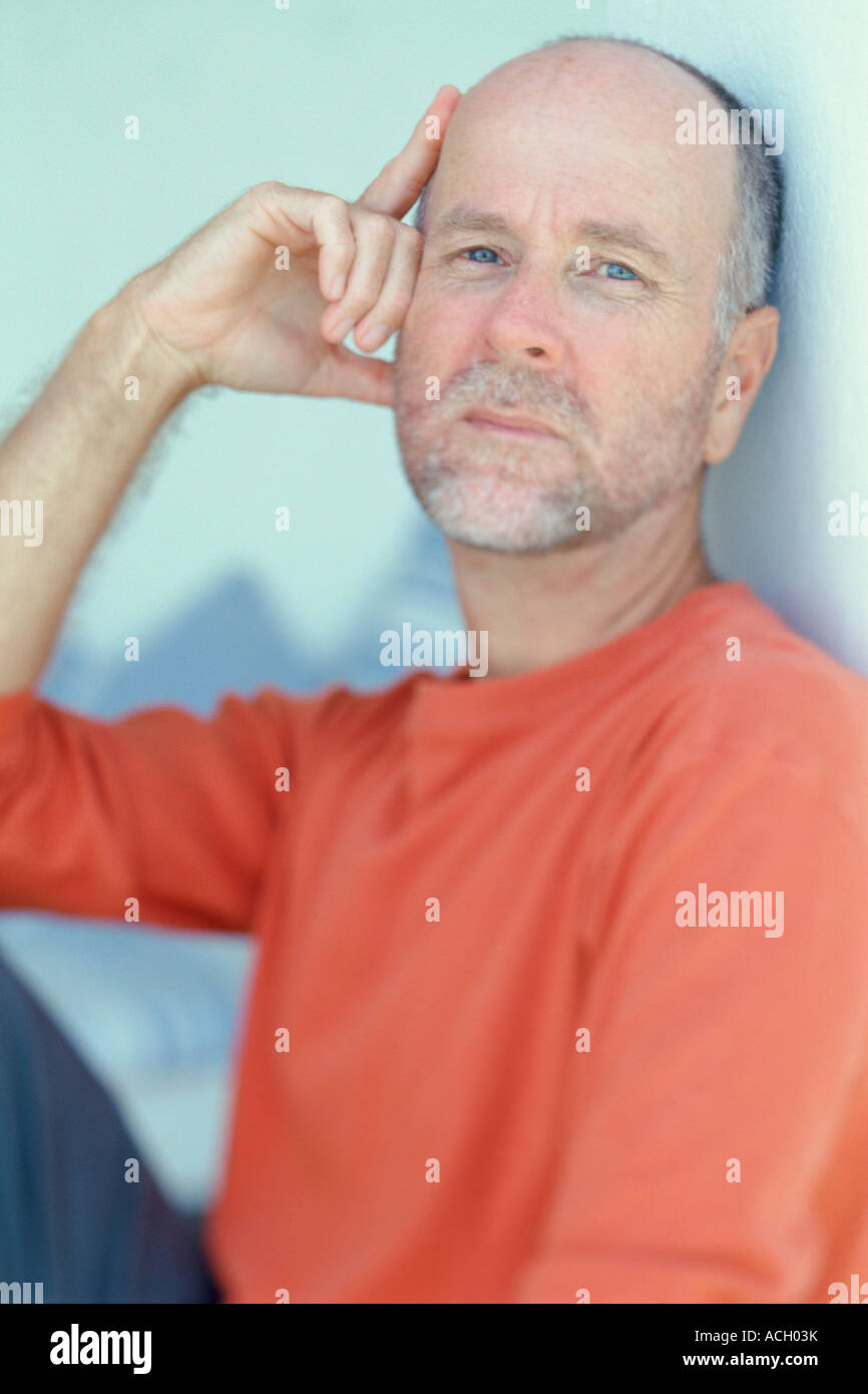 Portrait man posing hand on forehead Stock Photo - Alamy