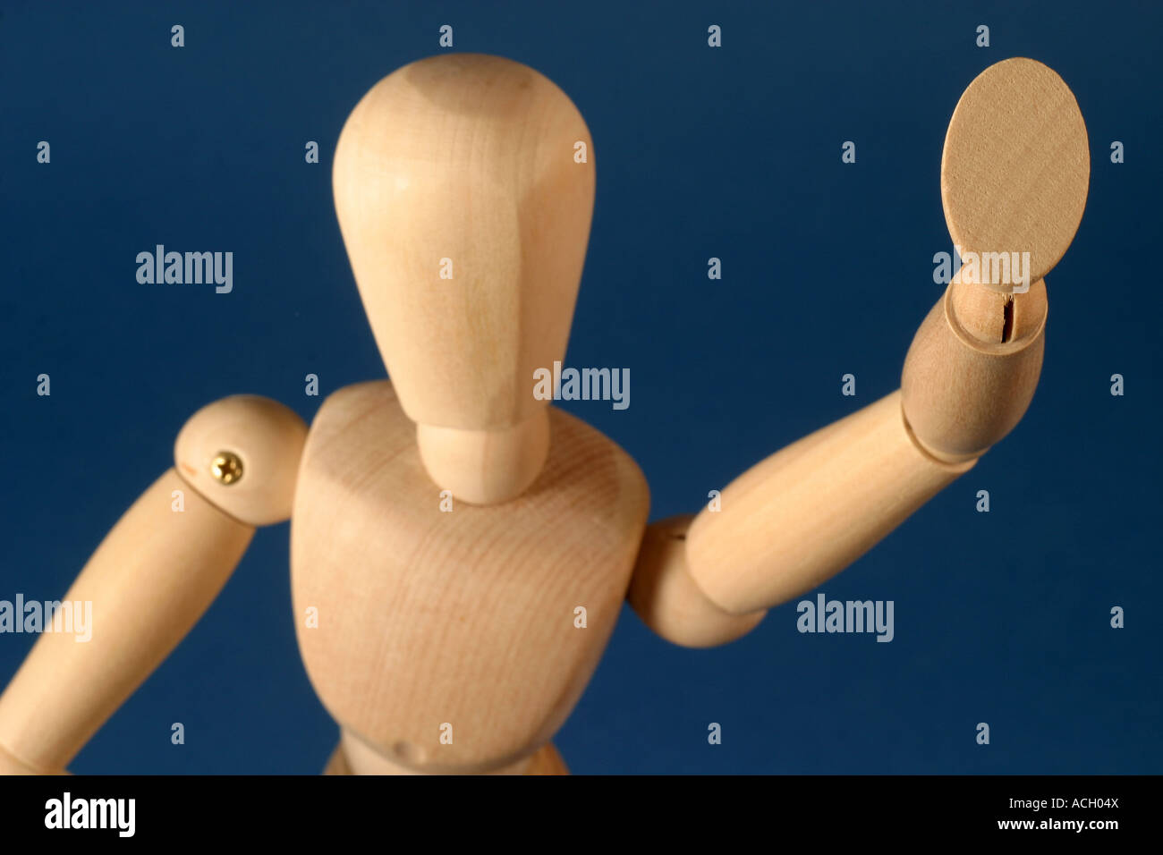 Artists doll with hand raised Stock Photo - Alamy