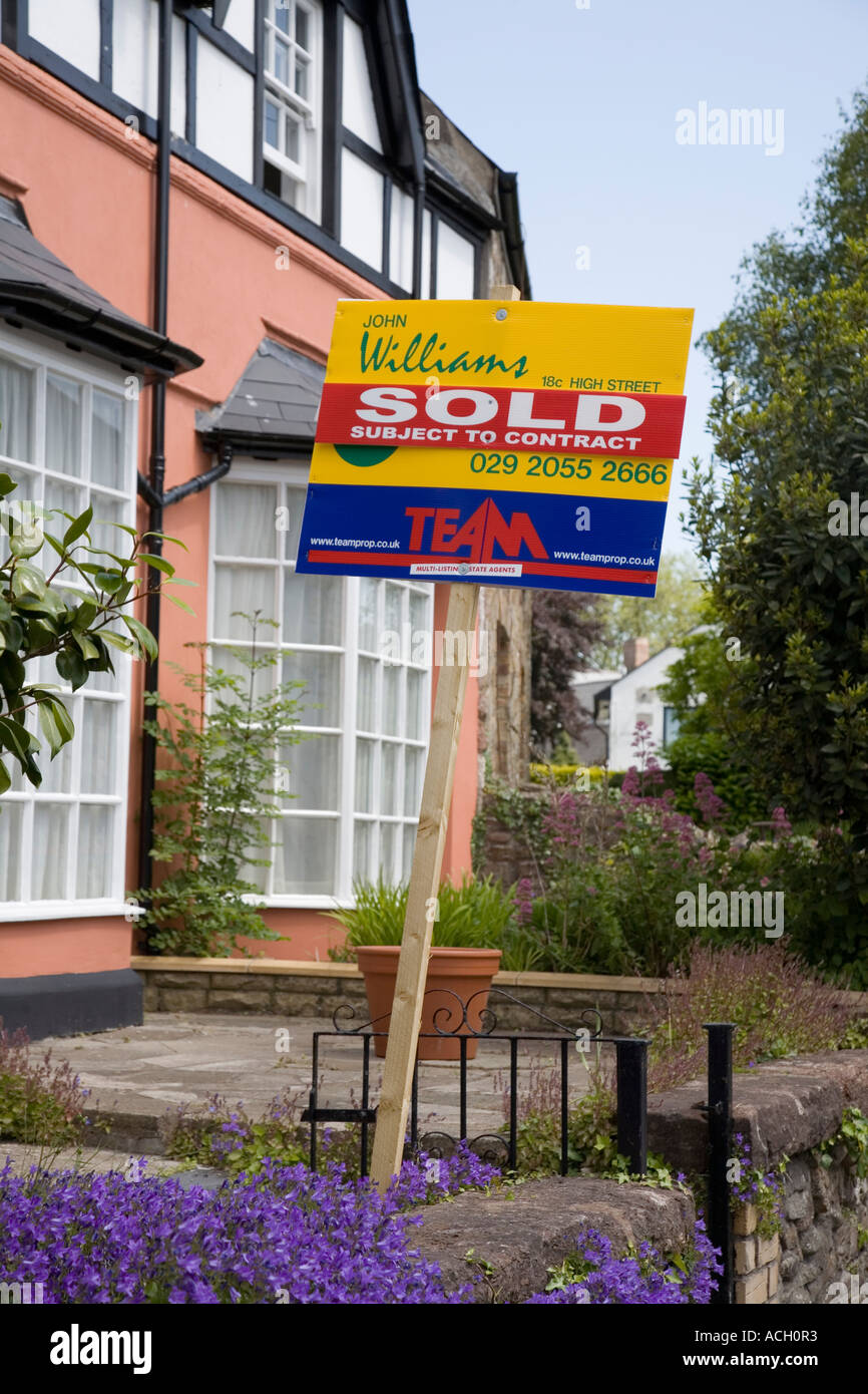 Sold subject to contract sign on estate agent sign on residential house ...