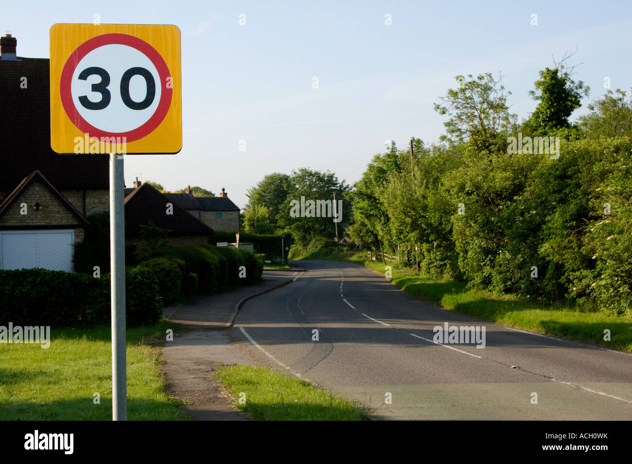 30 mph speed sign along road entering Stoke Goldington, Buckinghamshire ...