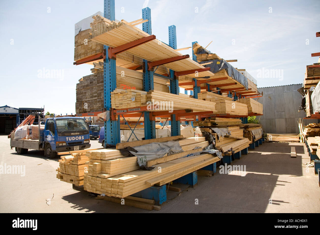 Sawn and planed timber on racks in builder merchant yard England UK ...
