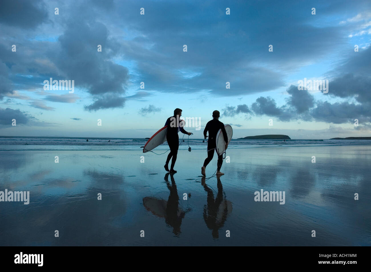 Surfers at dusk on Keel beach, Achill Island, Ireland Stock Photo - Alamy