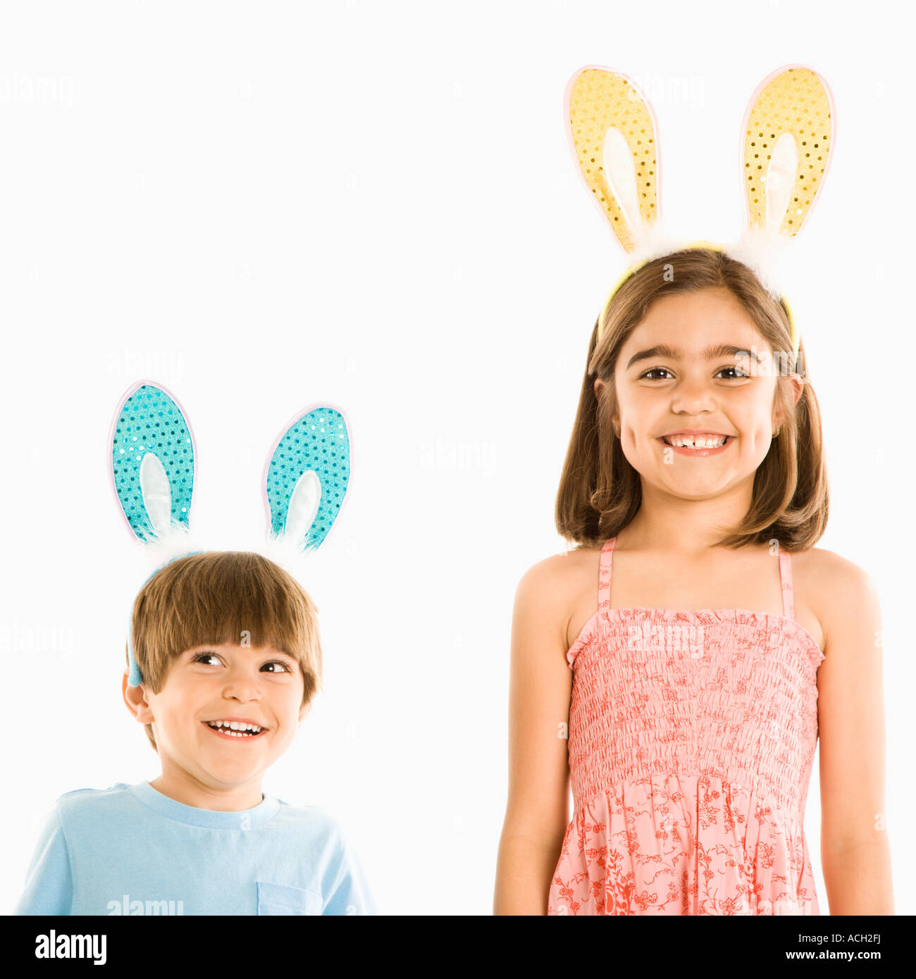 Portrait of boy and girl wearing rabbit ears smiling Stock Photo - Alamy