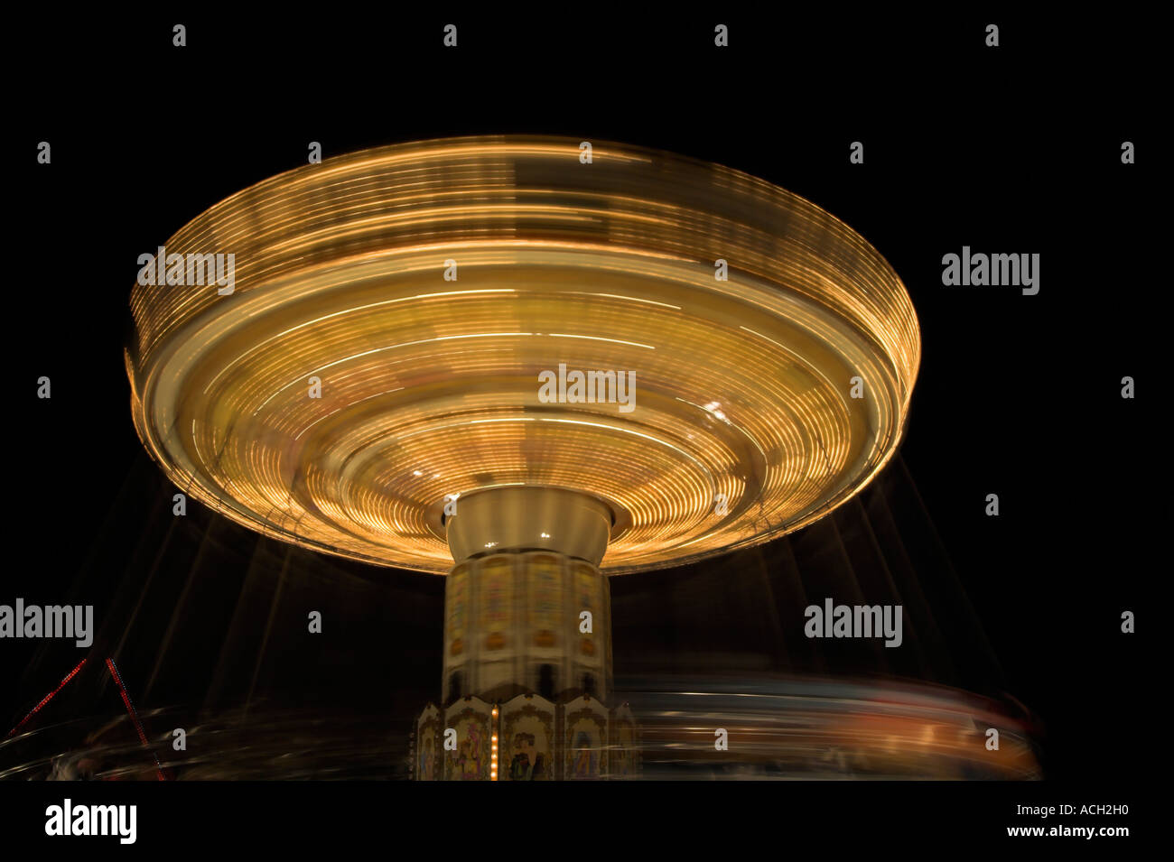 carousel spinning fast at a fair in Surrey Stock Photo - Alamy
