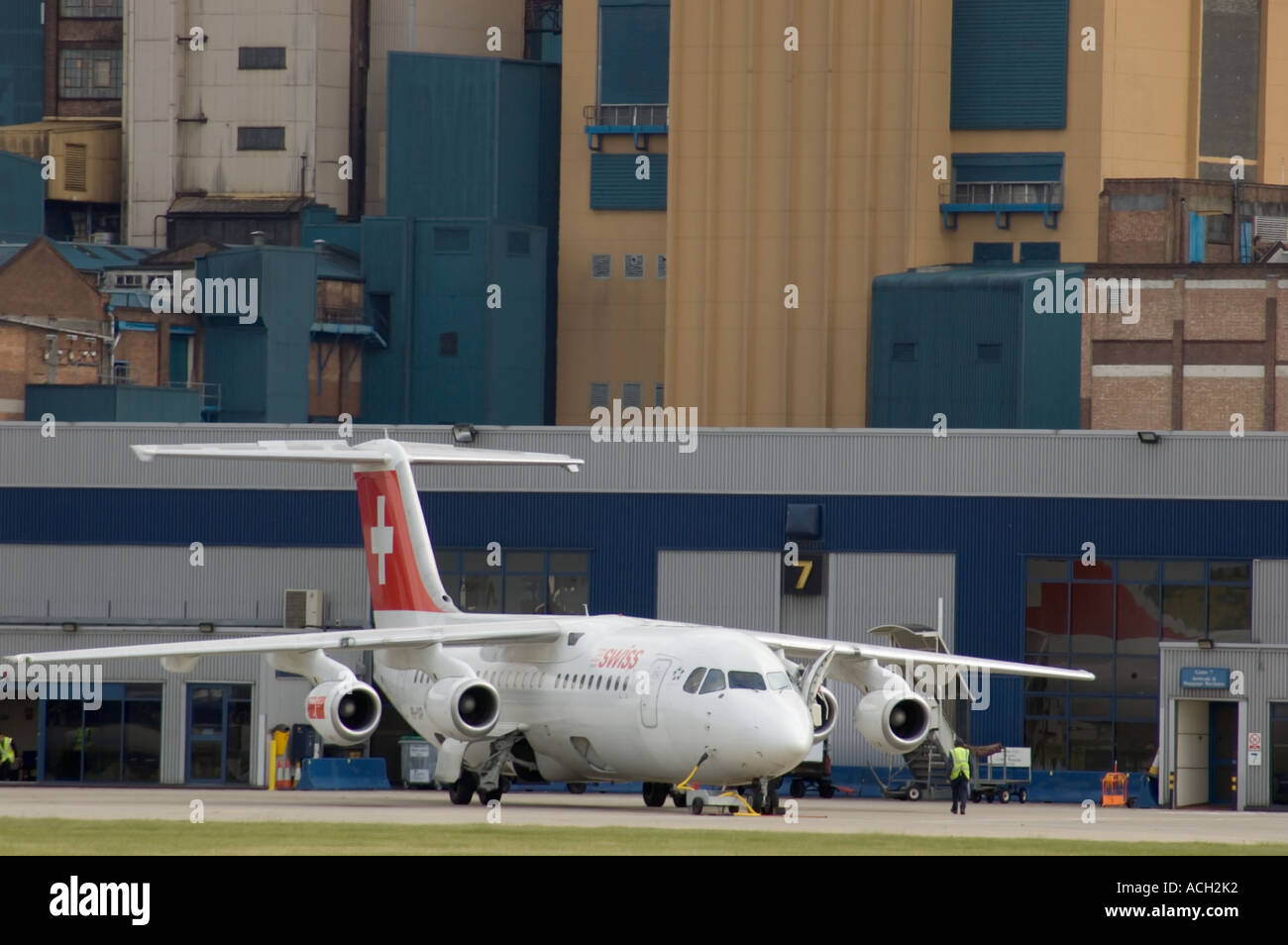 Swiss Air BAe 146 airplane at London City Airport with the Tate and ...