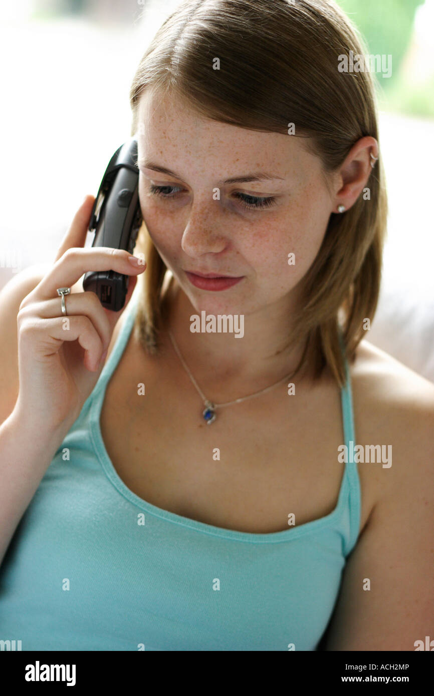 young woman using telephone Stock Photo - Alamy
