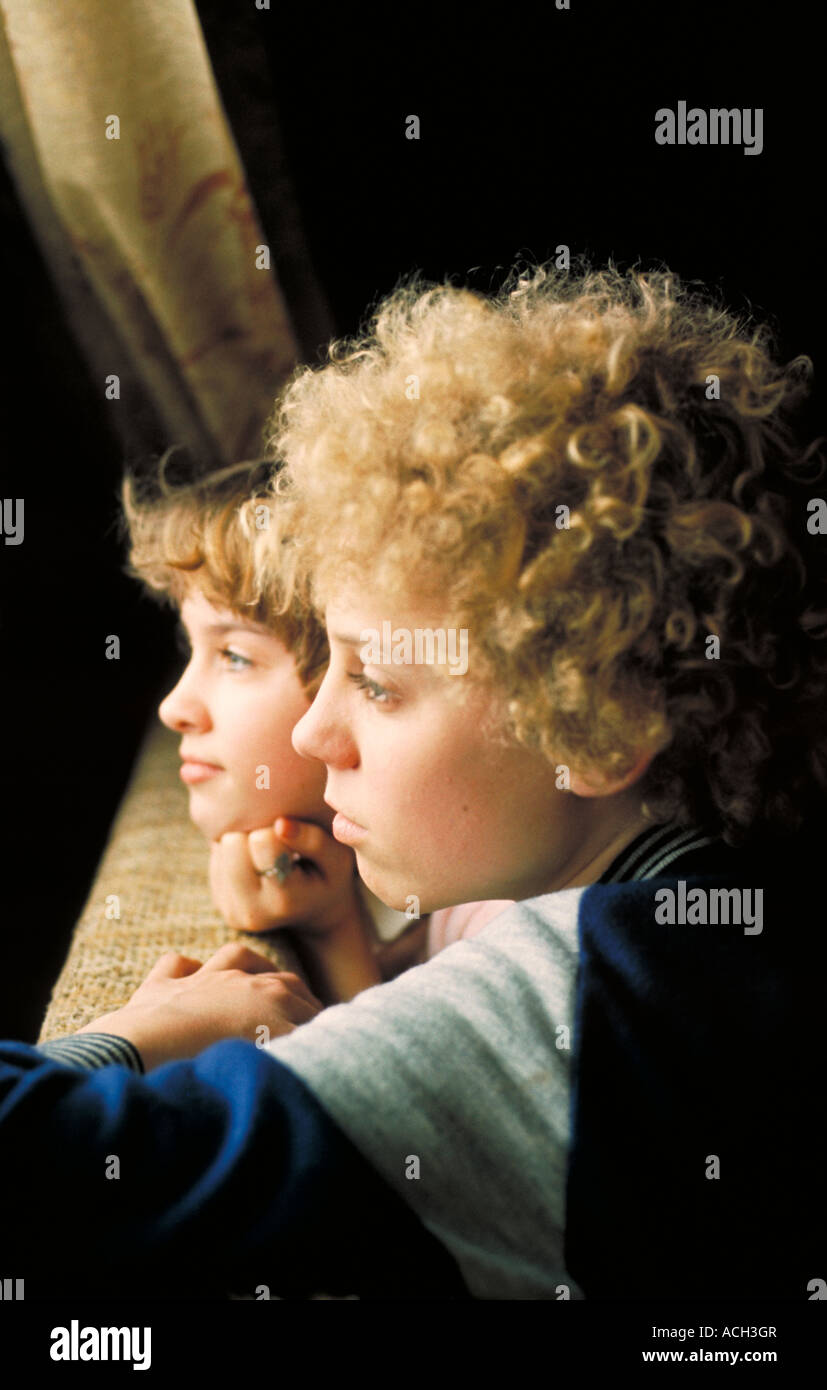 Two cousins looking out of a window. St. Paul, Minnesota Stock Photo ...