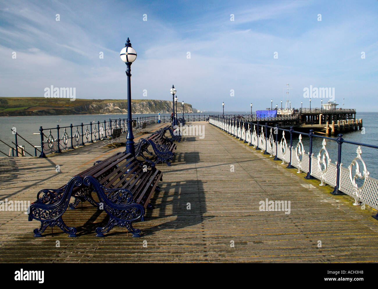Swanage Pier Dorset on summer's day looking out to sea with blue ray ...
