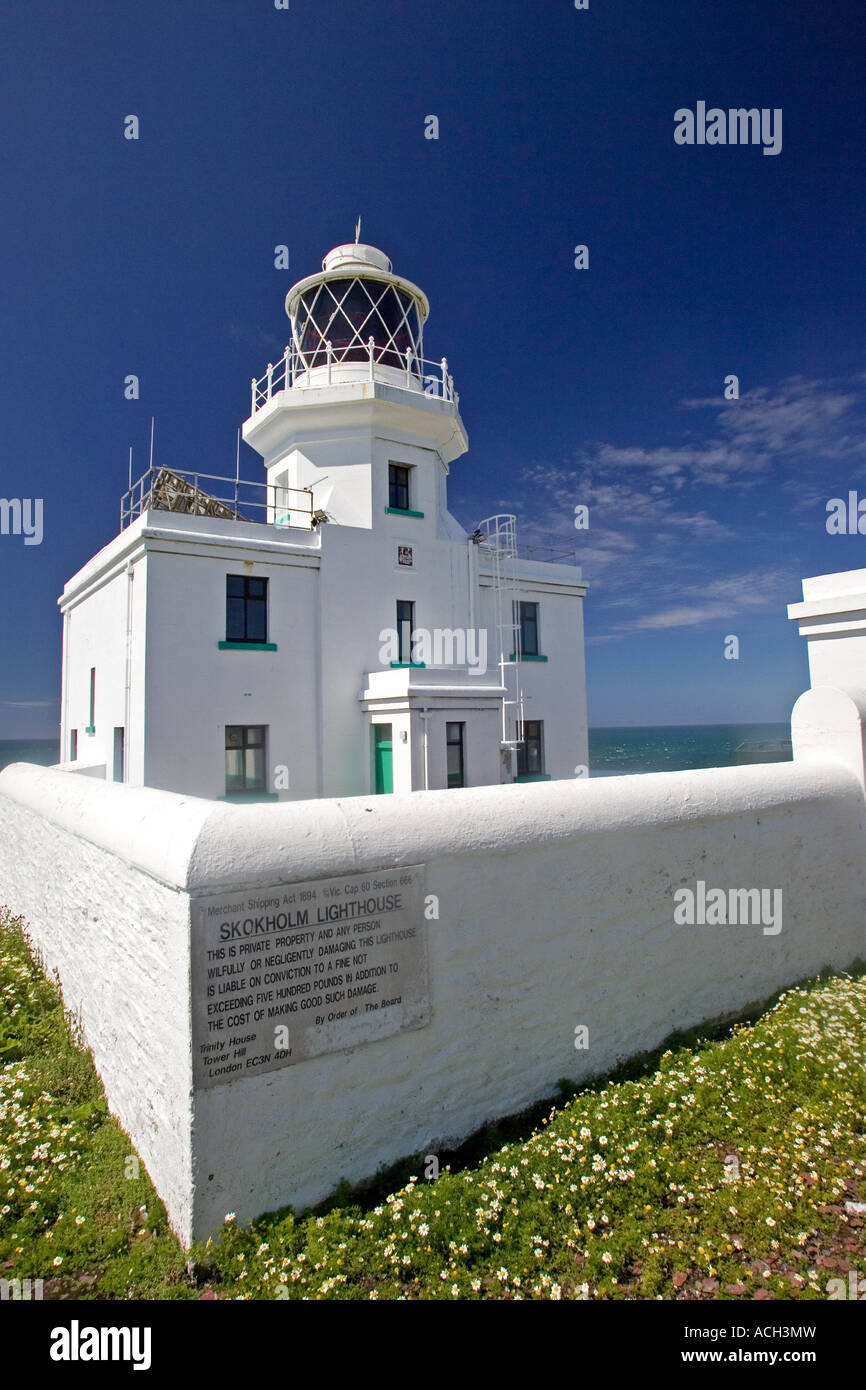 Trinity Lighthouse showing boundary wall, Skokholm Is Stock Photo - Alamy