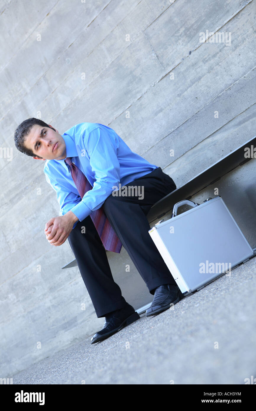 Businessman sitting on bench waiting hi-res stock photography and ...