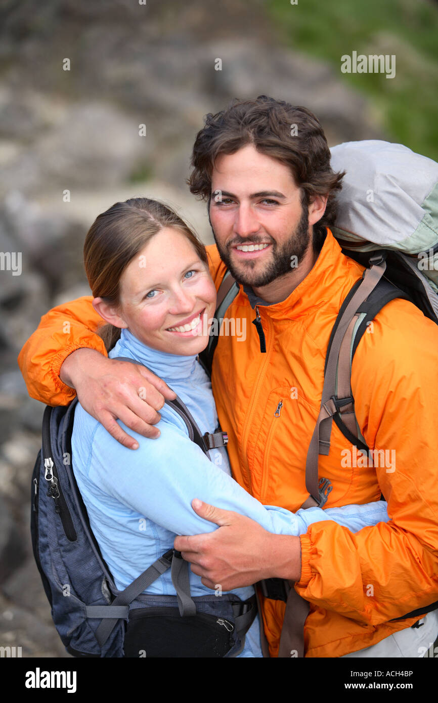 Backpacking couple pose for a portrait Stock Photo - Alamy
