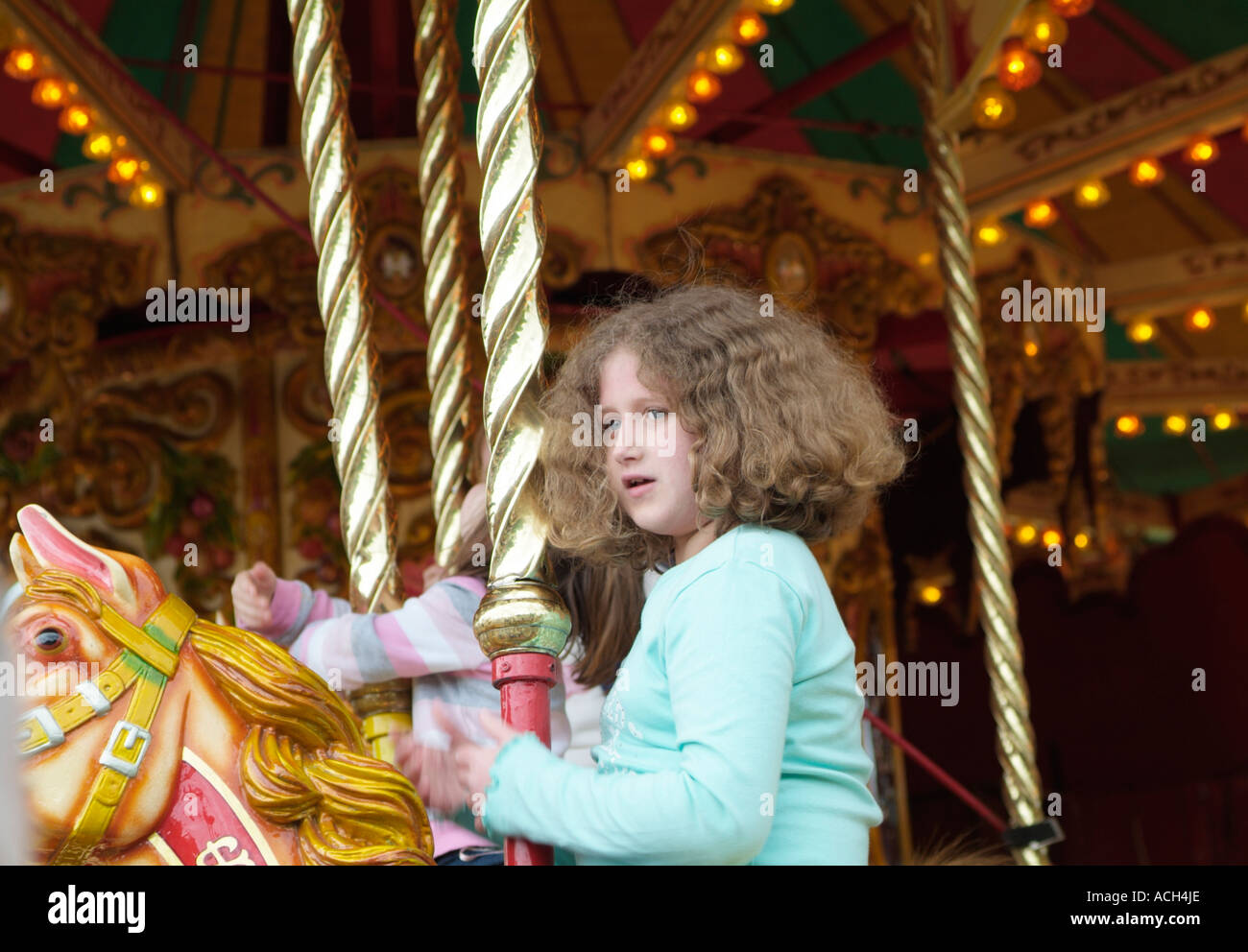 Girl on Carousel in Bushy Park, Surrey, England, UK Stock Photo - Alamy